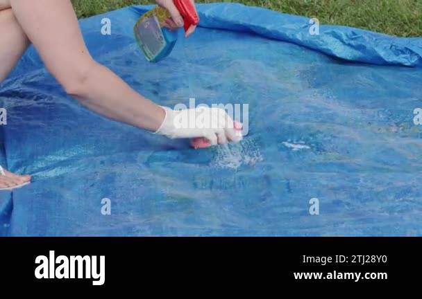 Cleaning pvc inflatable swimming pool, Cleaning the dirty empty pool of ...