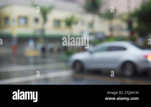 Background Plate of Rainy city intersections with car yielding at the ...