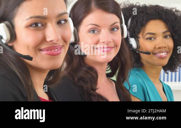 Three customer service representatives smiling Stock Video Footage - Alamy