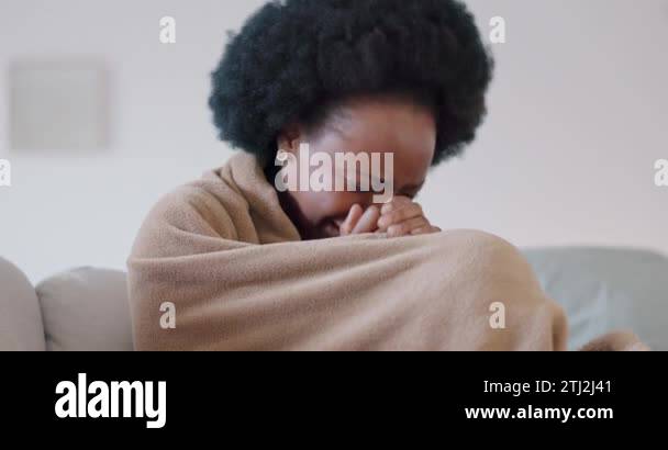 Sad crying black woman with depression at home on couch, sofa or living ...