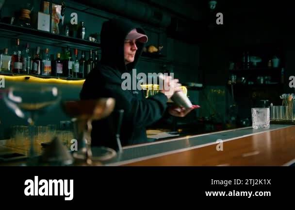 The process of making a cocktail in a bar A bartender mixes the ...