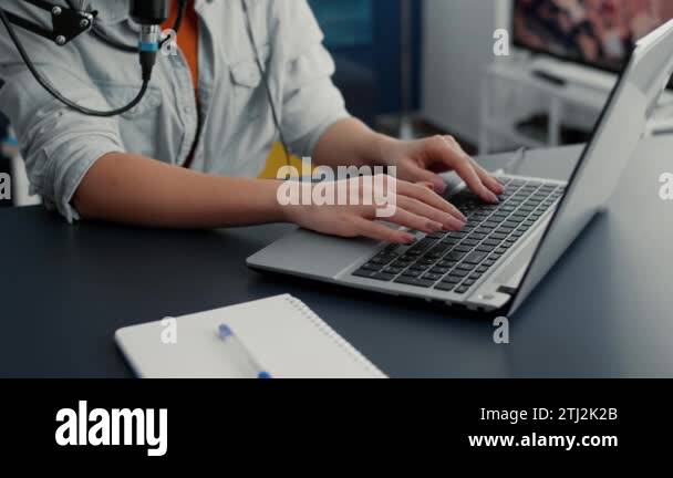 Podcast internet show host typing on computer while talking to public ...