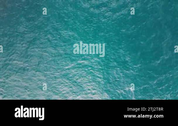 Sea surface top down aerial view. Camera flies over the water surface ...
