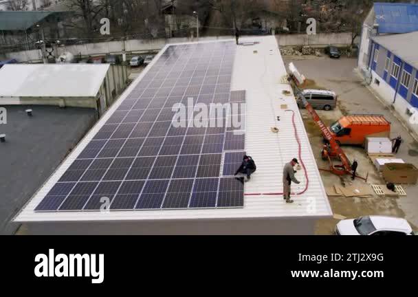 Technician installing solar panels on house roof. Concept.renewable energy, technology ...