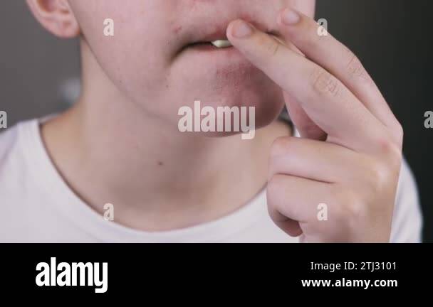 Close up, Child Chews Chewing Gum on a Blurred Background and Shows ...