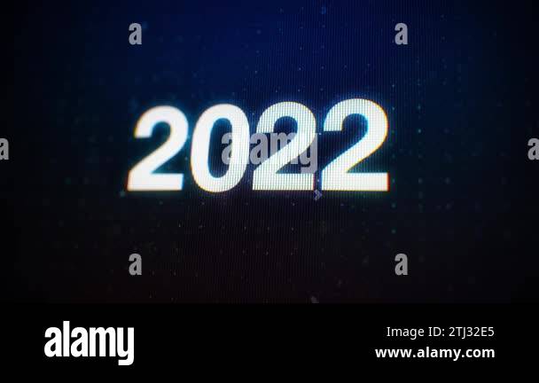 2022 year changing to 2023. White glowing digits on LCD computer screen ...