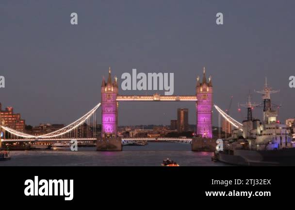 London Tower Bridge with pink and purple lights on because of Queen ...
