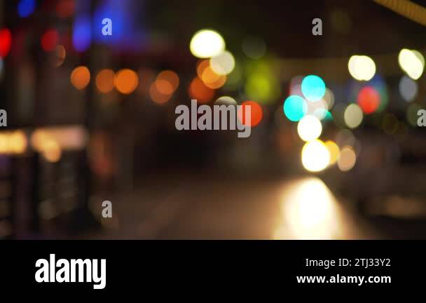 Background plate of out of focus city street sidewalk at night. Out of ...