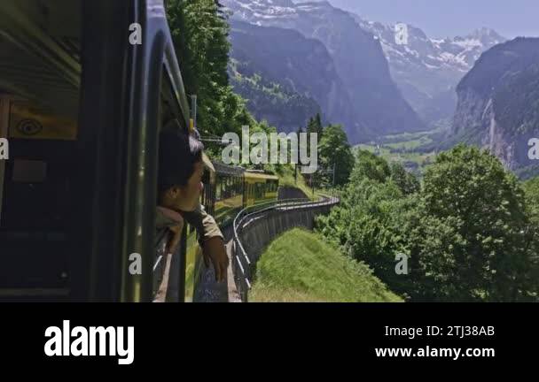 Scenic Train Ride in the Valley of Alps Mountain Window With A Man ...