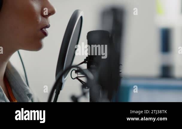 Internet live radio talk show host talking to audience at microphone ... Internet live radio talk show host talking to audience at microphone ...