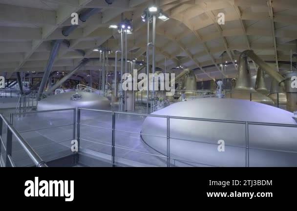Interior pipework, copper stills and mash tuns highlighting the ...