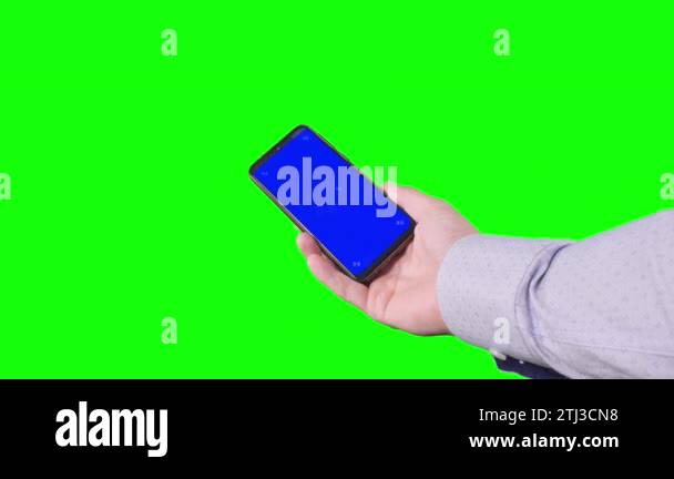 Male hand holding a smartphone with a blue screen and trackers on a ...