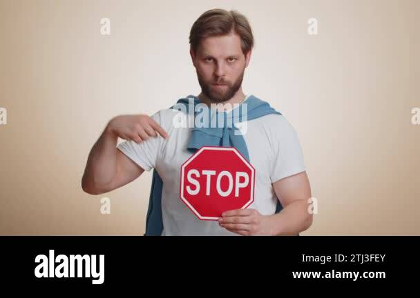 Angry man say No hold Stop sign banner logo, warning of finish ...