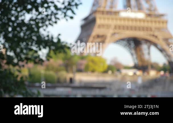 Close up blurry view Eiffel Tower across the River Seine in Paris. Out ...