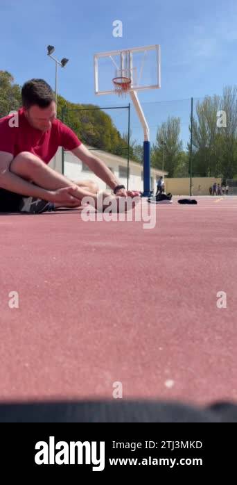 Adult caucasian barefoot basketball player wearing red t-shirt ...