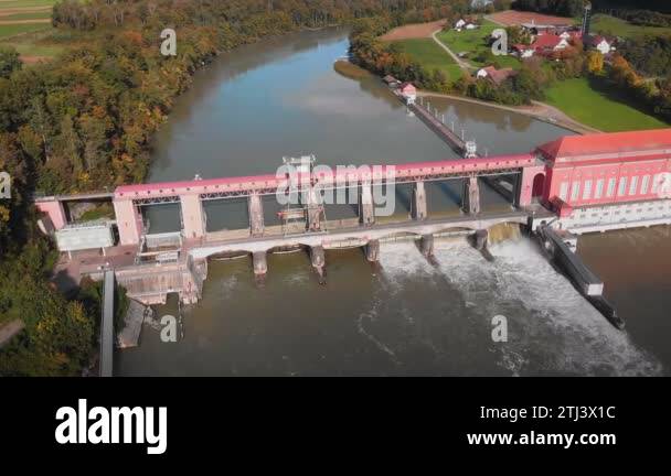 Large river dam. Powerful water stream rushing through opened gates at ...