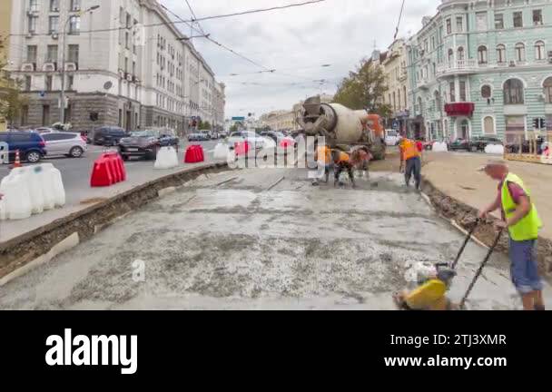 Concrete works and compaction for road construction site with many ...
