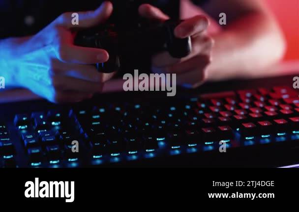 Gaming man. Cyber fun. Night entertainment. Guy hands playing on ...