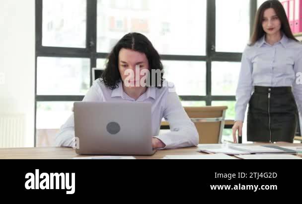 Transgender business manager getting frightened and pushing away woman ...