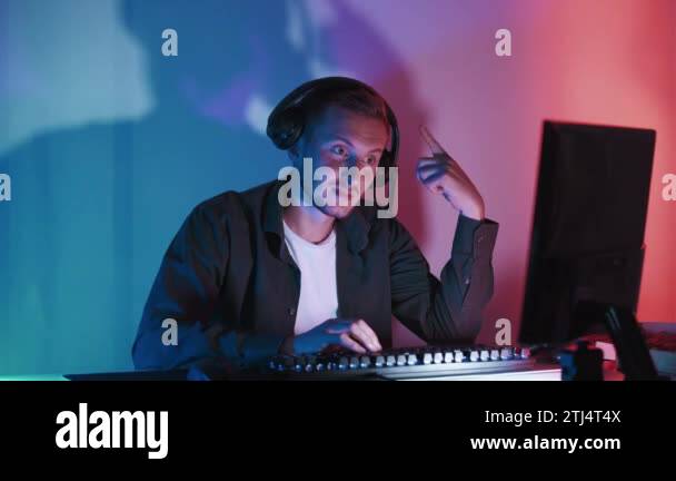 Watching streaming. Online meeting. Night work. Bored male looking at ...