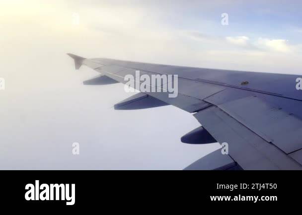 A stunning video clip captures the moment an airplane wing emerges from ...