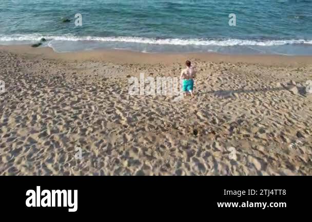 Man running beach Stock Videos & Footage - HD and 4K Video Clips - Alamy