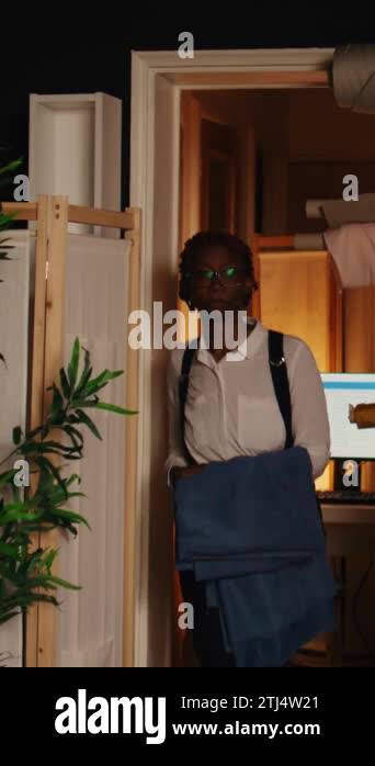 Vertical video Tailor and student choosing design to create tailored ...