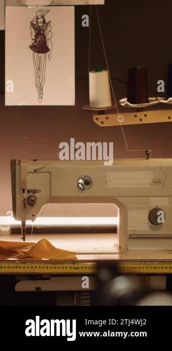 Vertical video Tailor workshop sewing machine and tools used for custom ...