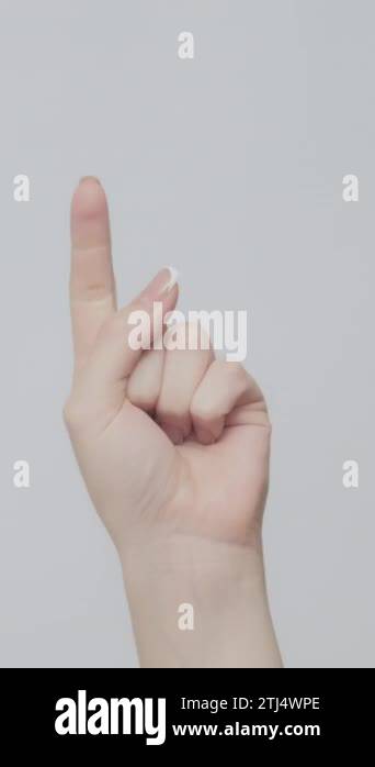 Vertical video. Hand gesture. Numbers calculating. Woman counting from 1 to 5 fingers on light ...