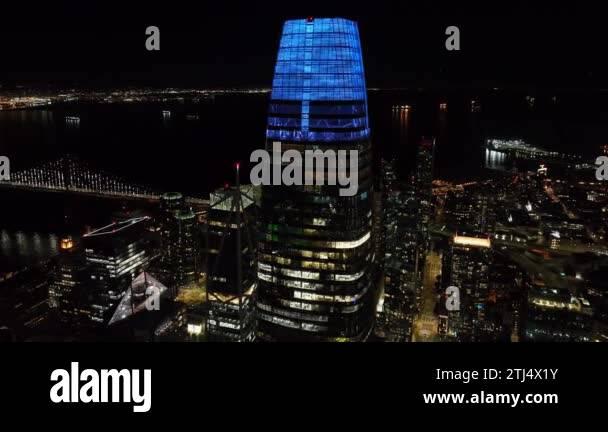 Circular footage of top section of Salesforce Tower at night. Modern ...