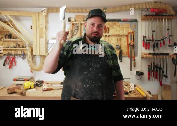 Portrait of a carpenter posing with a Japanese saw. Traditional ...
