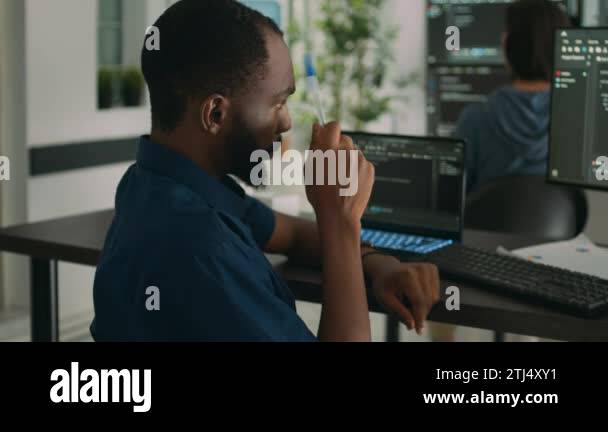 African American System Engineer Thinking About Html Script Development To Code It Language In