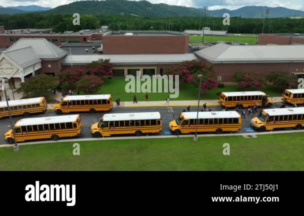 Line up of school bus. Students exit building. Nelson County Virginia ...