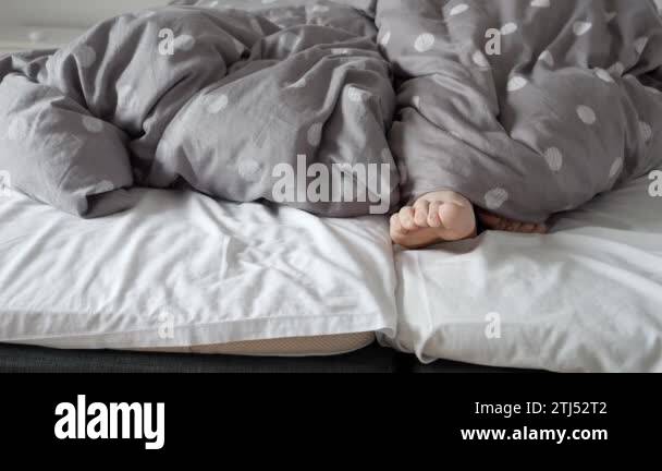 Couples feet in bed Stock Videos & Footage - HD and 4K Video Clips - Alamy
