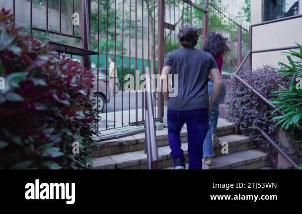 Man and woman going into building Stock Videos & Footage - HD and 4K ...