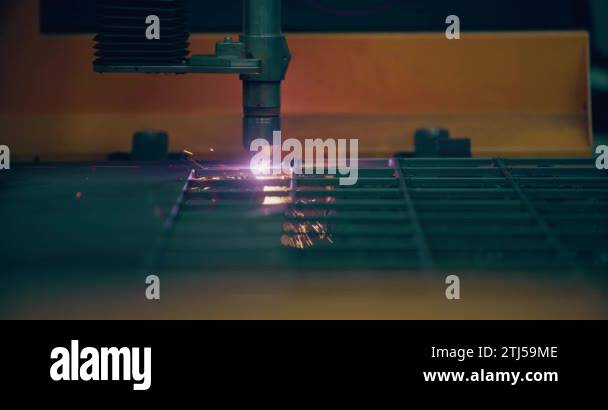 Plasma laser cutting metal sheets with sparks, precision fabrication ...
