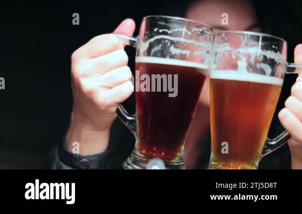 Woman acting silly celebrating with craft beers toasting herself ...