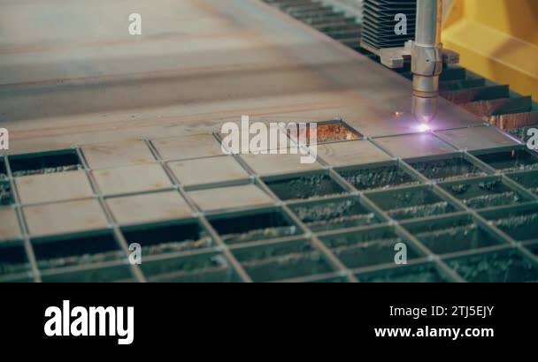 Plasma laser cutting metal sheets with sparks, precision fabrication ...