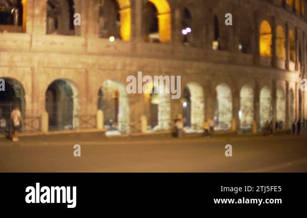 Camera pan movement of ancient building on modern street in Europe ...