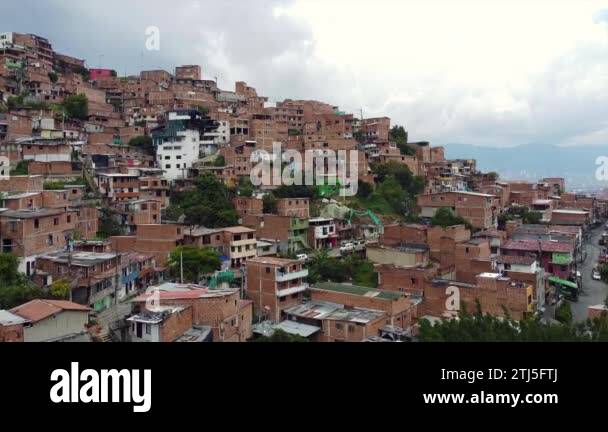 Medellin, Colombia, drone aerial view of Comuna 13 slums, favela. Once ...