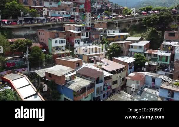 Medellin, Colombia, drone aerial view of Comuna 13 slums. Once one of ...