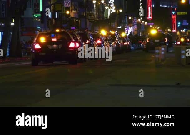 Lot of Police cars parked on the illuminated streets of Los Angeles ...
