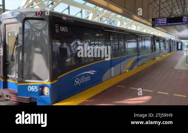 skytrain Blue Line Surrey Vancouver Surrey center station Arriving blue train at Surrey Center ...