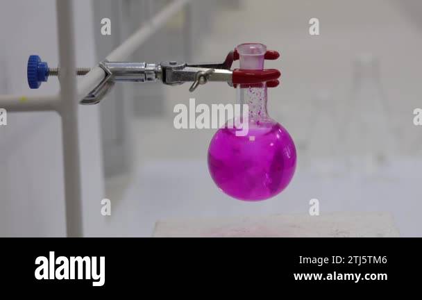 Mixing colored solution with a magnetic stirrer. Formation of a ...