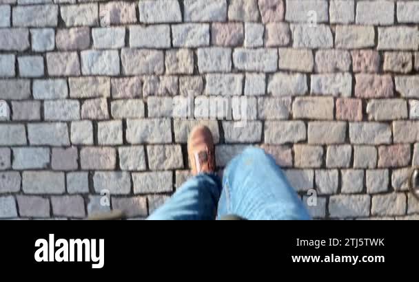 Point of view of man walking in cobblestone medieval town. POV of ...