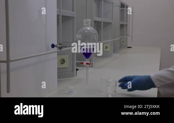 Separating funnel laboratory glassware used in liquid-liquid ...
