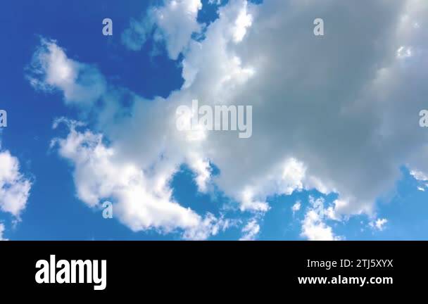 Blue sky white clouds. Puffy fluffy white clouds. Cumulus cloud cloudscape timelapse. Summer ...
