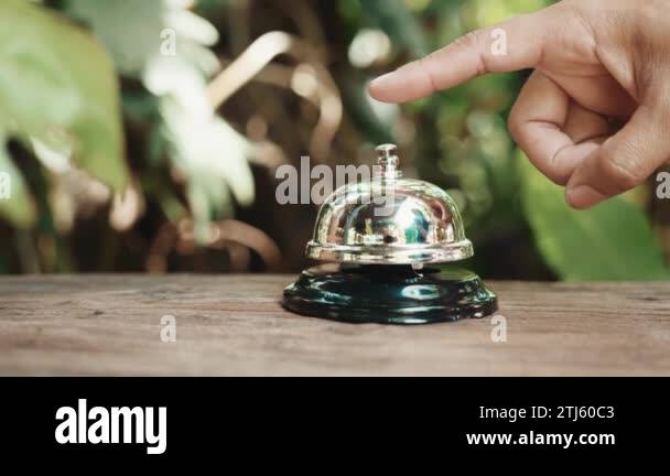 Hospitality hotel. Customer hand ringing service bell at coffee cafe ...