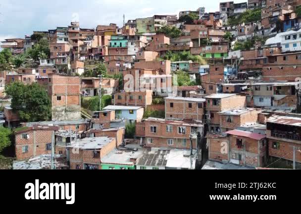 Medellin, Colombia, drone aerial view of Comuna 13 slums. Once one of ...