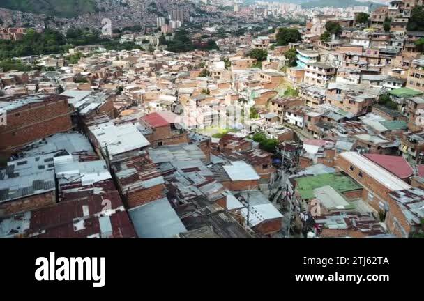 Medellin, Colombia, drone aerial view of Comuna 13 slums, favela. Once ...
